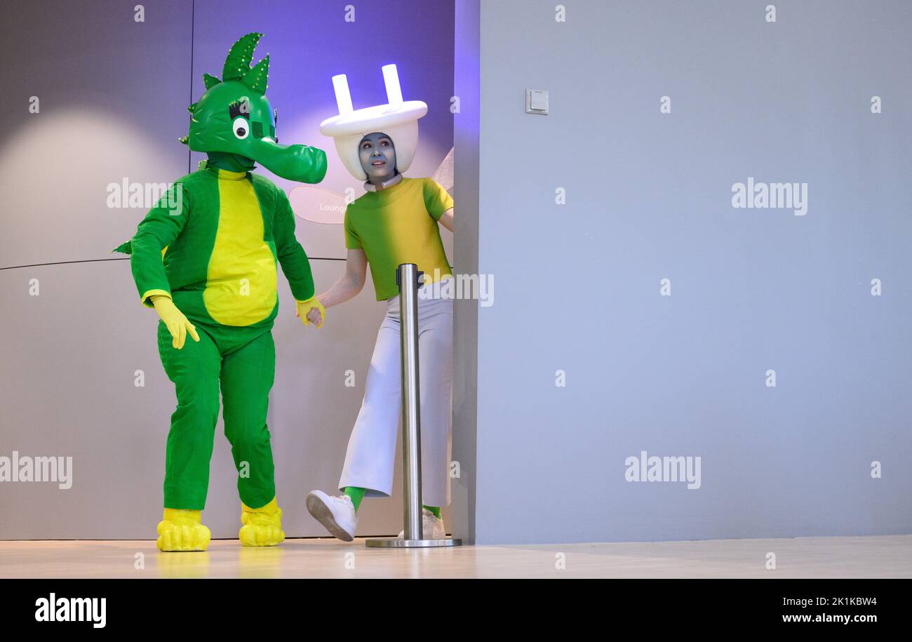 Dresden, Germany. 19th Sep, 2022. The dragon Tabaluga (l) leads the ...