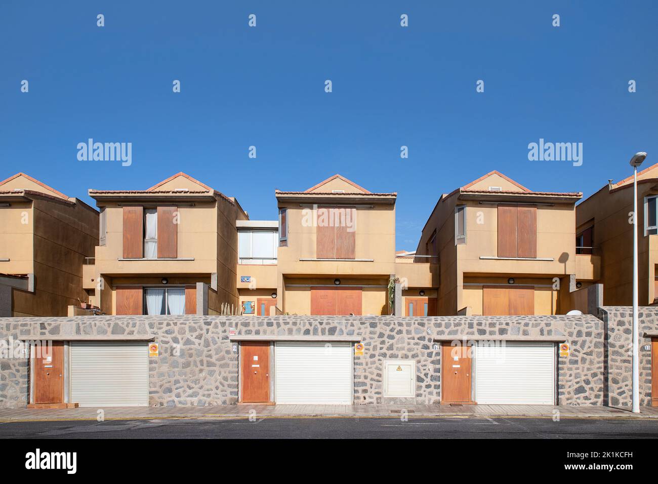 Street view of several identical townhomes in the popular tourist ...