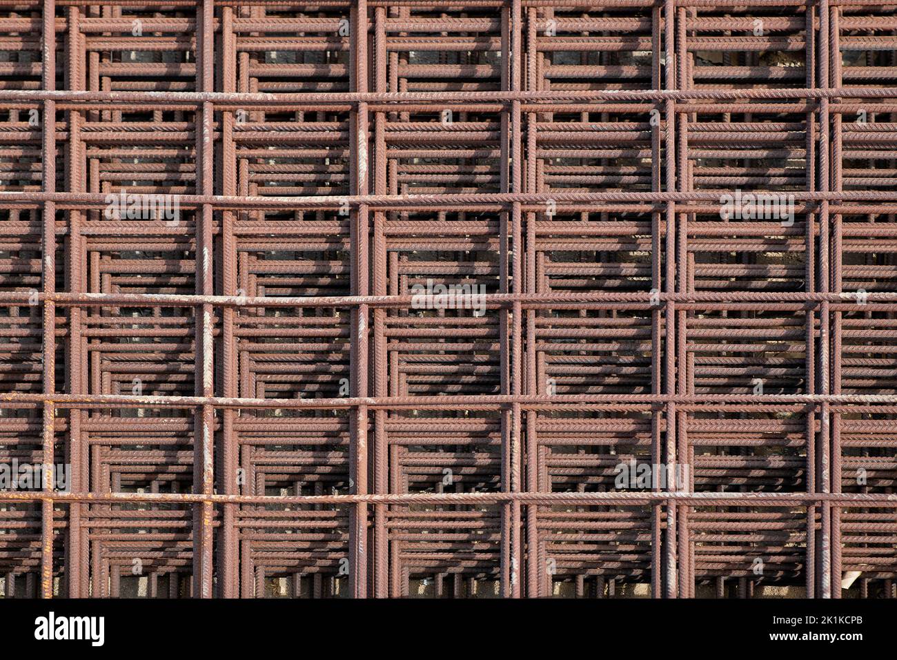 Reinforcing iron mesh stacked on top of each other and forming a ...