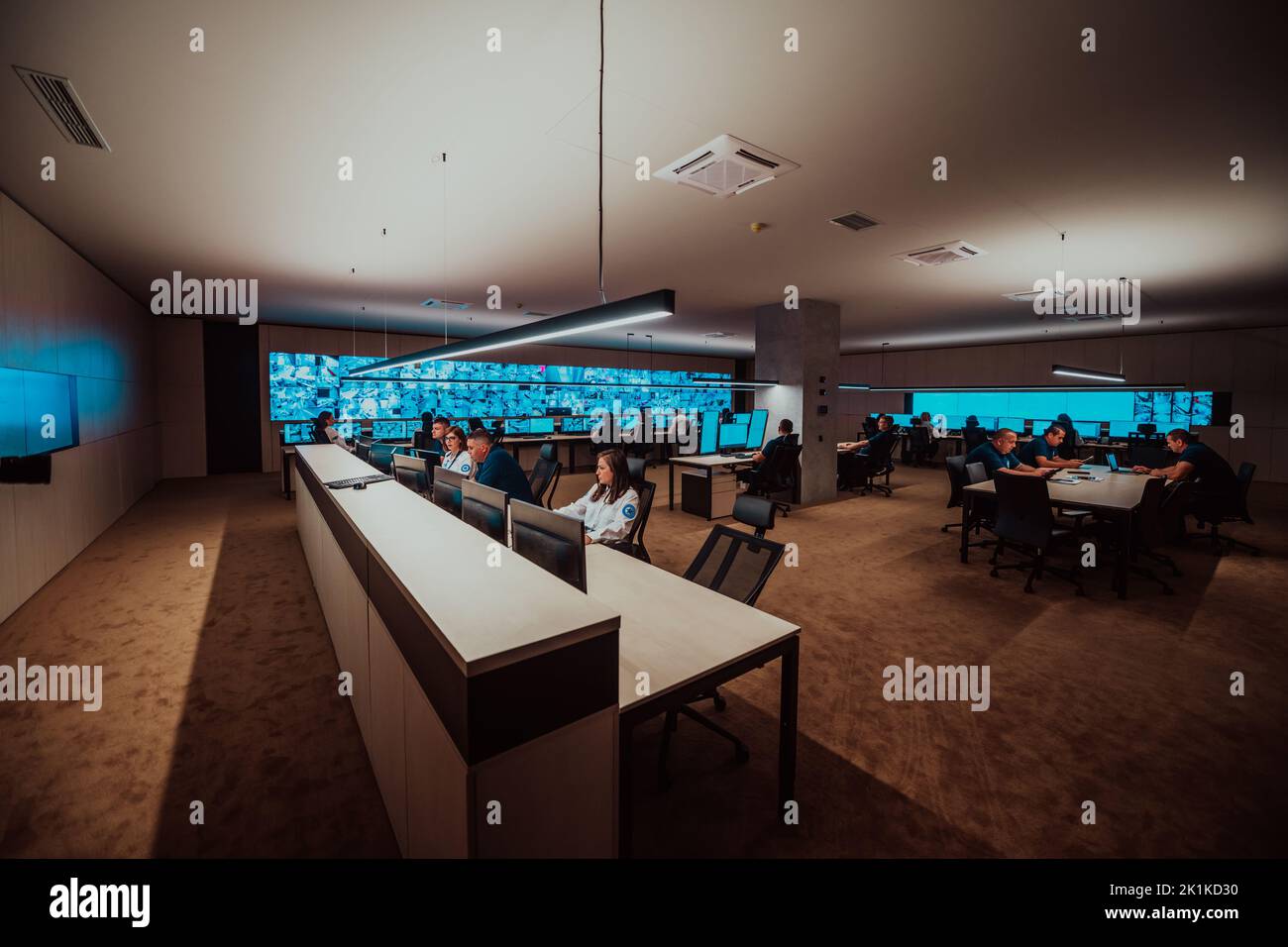 Group of Security data center operators working in a CCTV monitoring ...