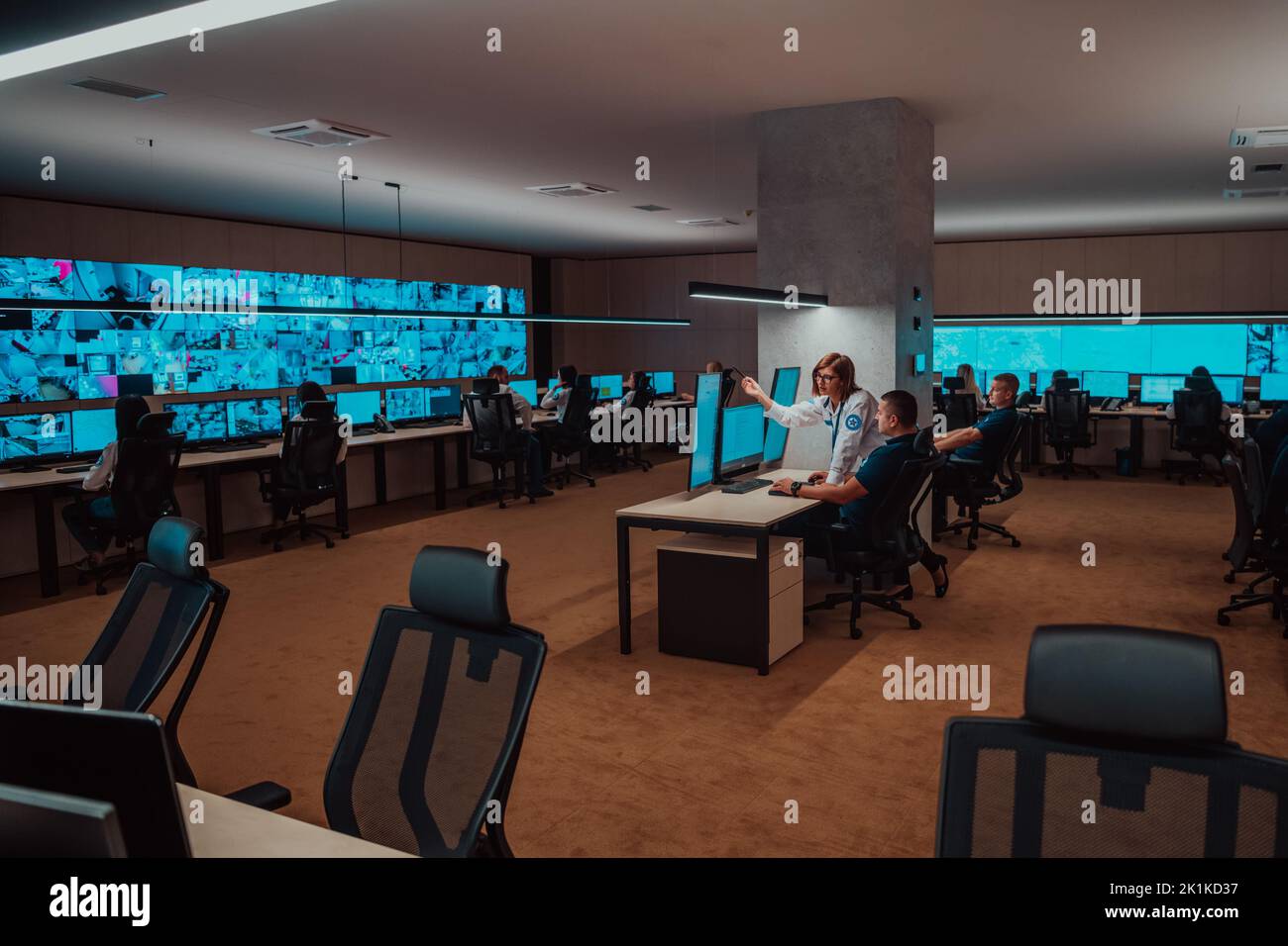 Group of Security data center operators working in a CCTV monitoring ...