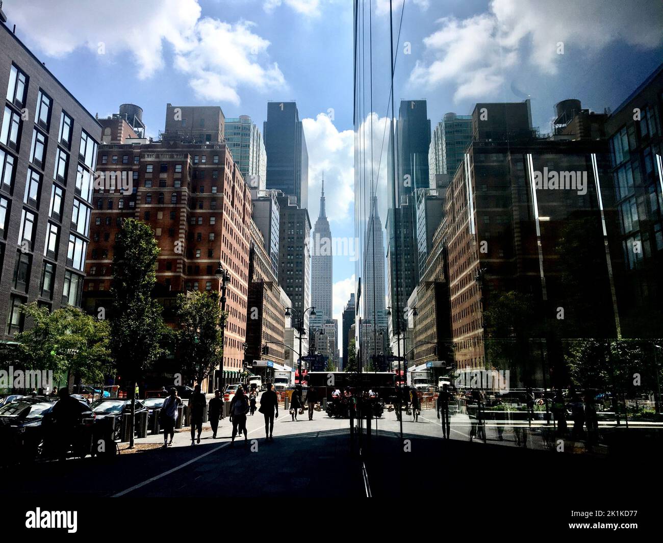 The Empire State Building and reflection from West 33rd Street, in ...
