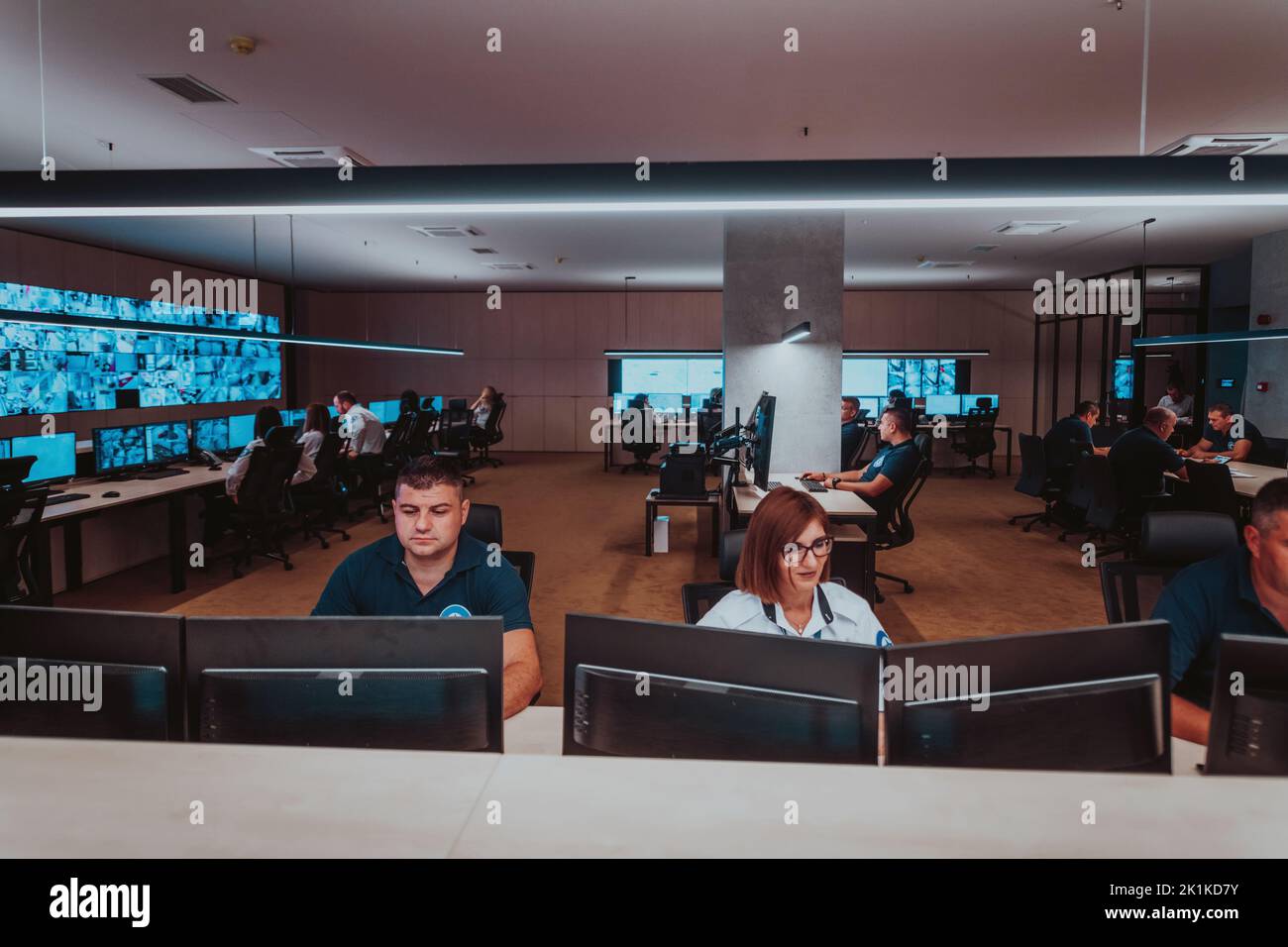 Group of Security data center operators working in a CCTV monitoring ...