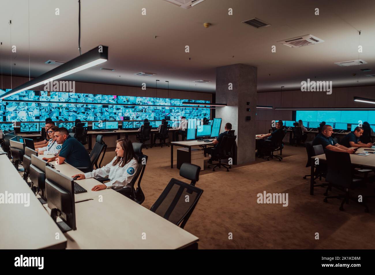 Group of Security data center operators working in a CCTV monitoring ...
