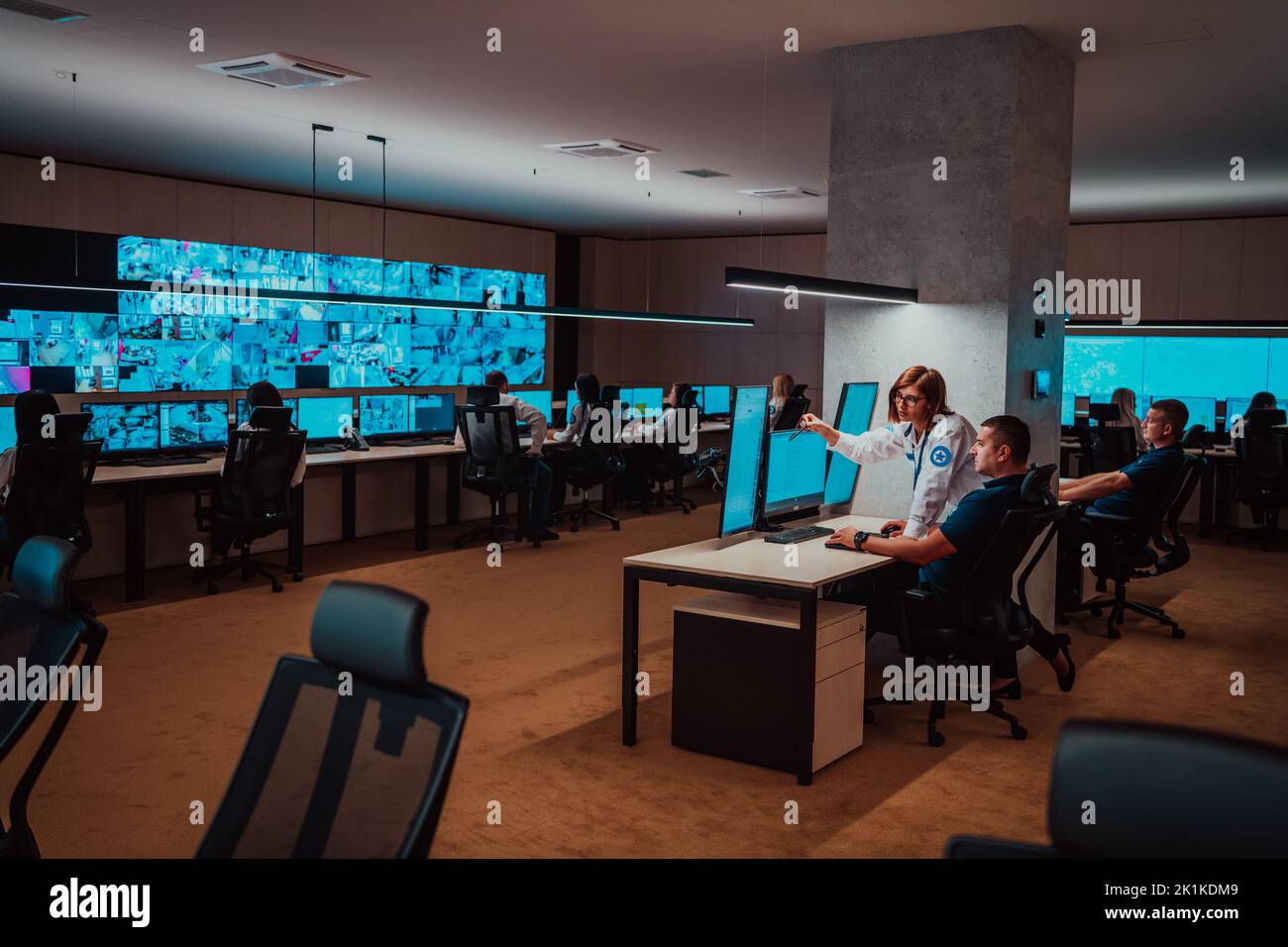 Group of Security data center operators working in a CCTV monitoring ...