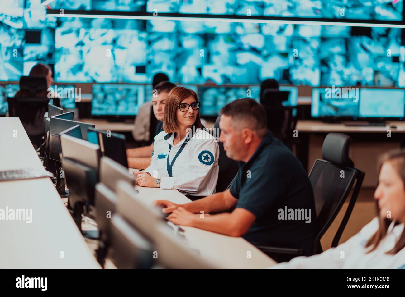 Group of Security data center operators working in a CCTV monitoring ...