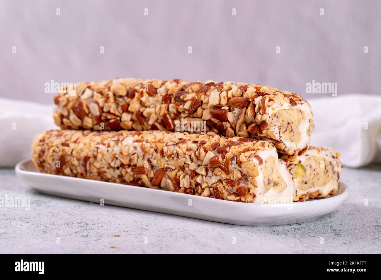 Turkish delight with almonds on a gray background. Turkish delight with ...