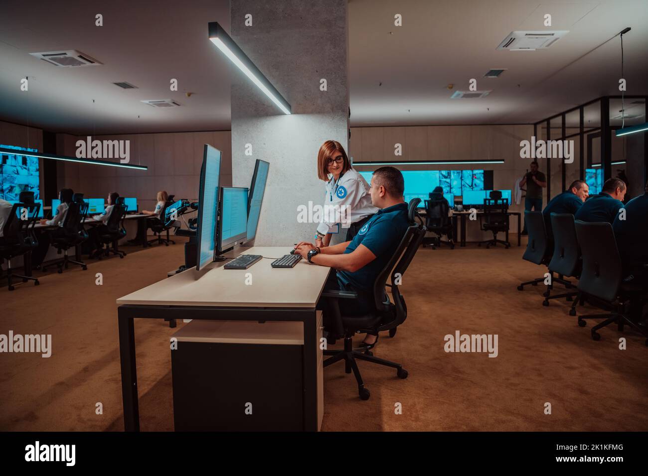 Group of Security data center operators working in a CCTV monitoring ...