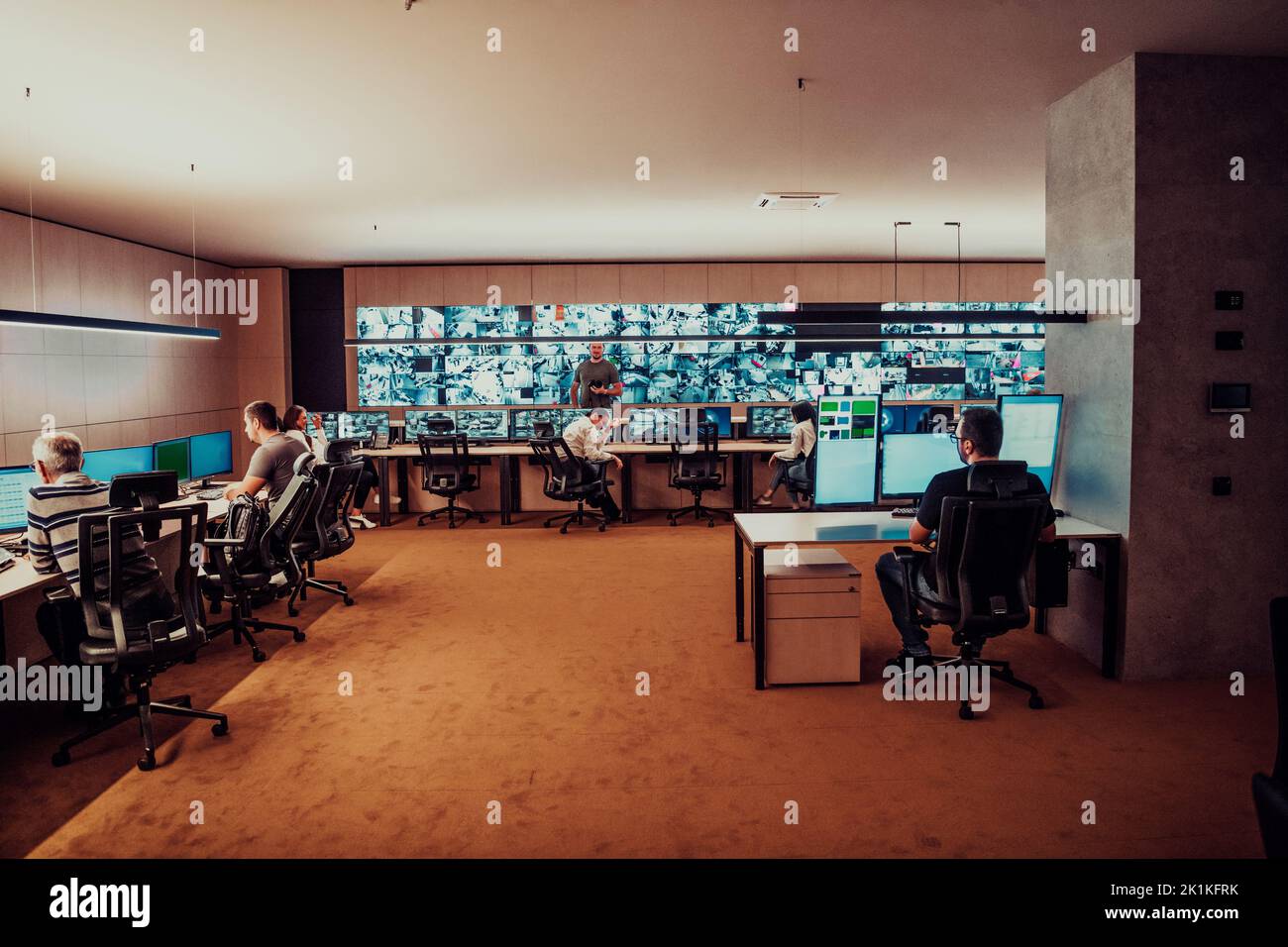 Group of Security data center operators working in a CCTV monitoring ...