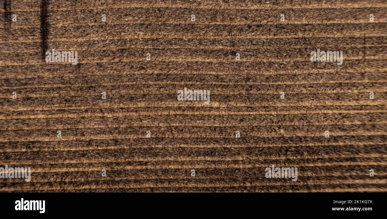 Dark brown wooden cutting, chopping board, table or floor surface. Wood ...