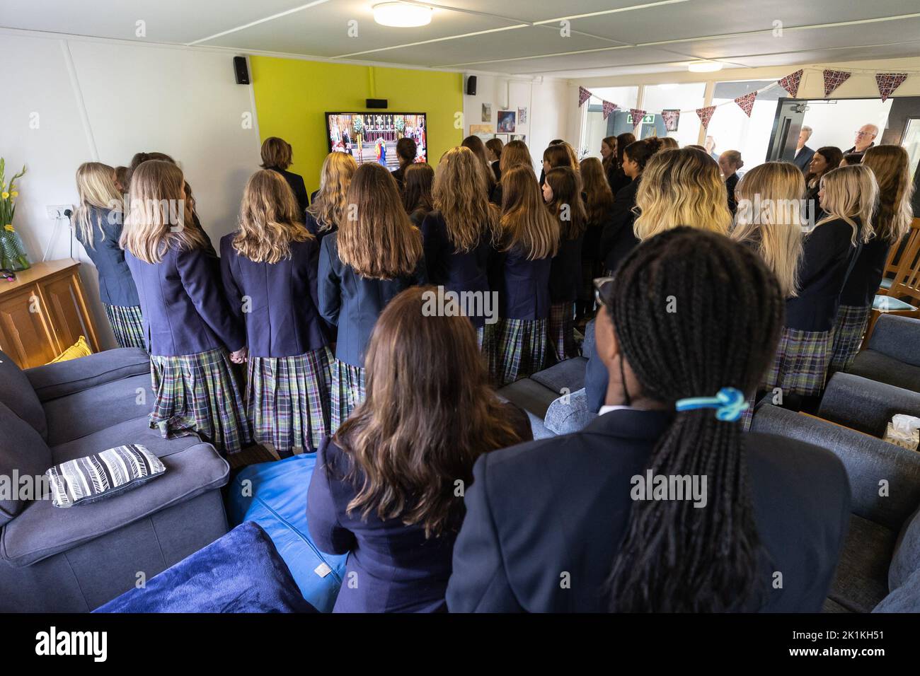 Students watch the state funeral of Queen Elizabeth IIl in their ...