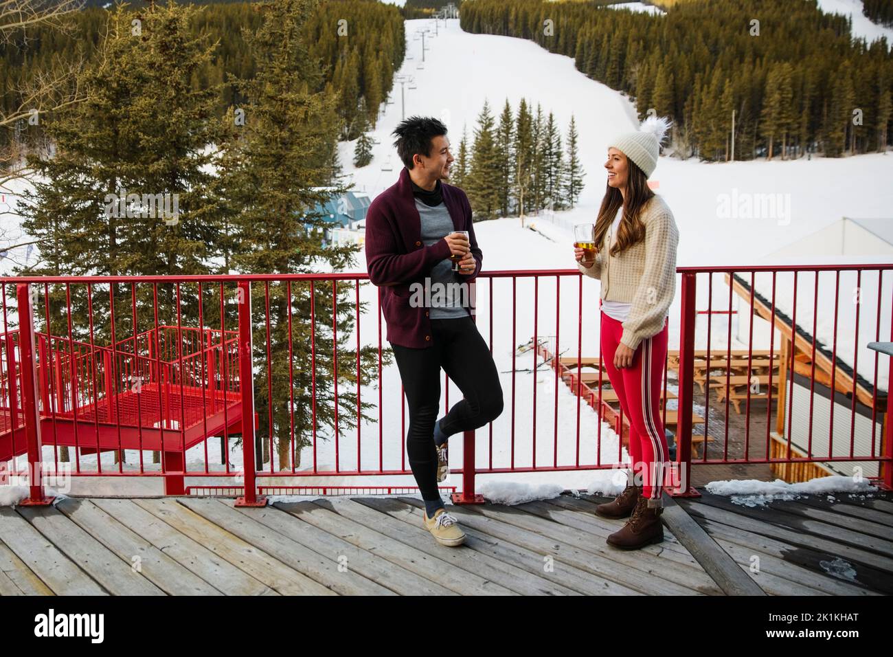 Two people talking on balcony hi-res stock photography and images - Alamy