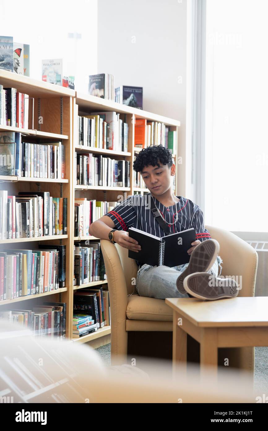 Boy book library hi-res stock photography and images - Alamy