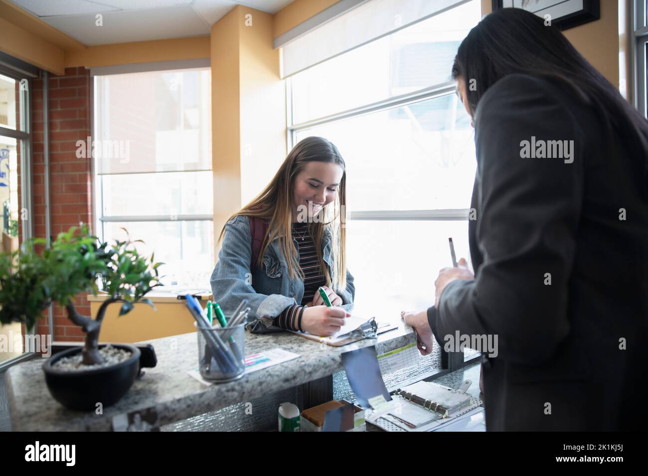 High school girl standing in hi-res stock photography and images - Alamy