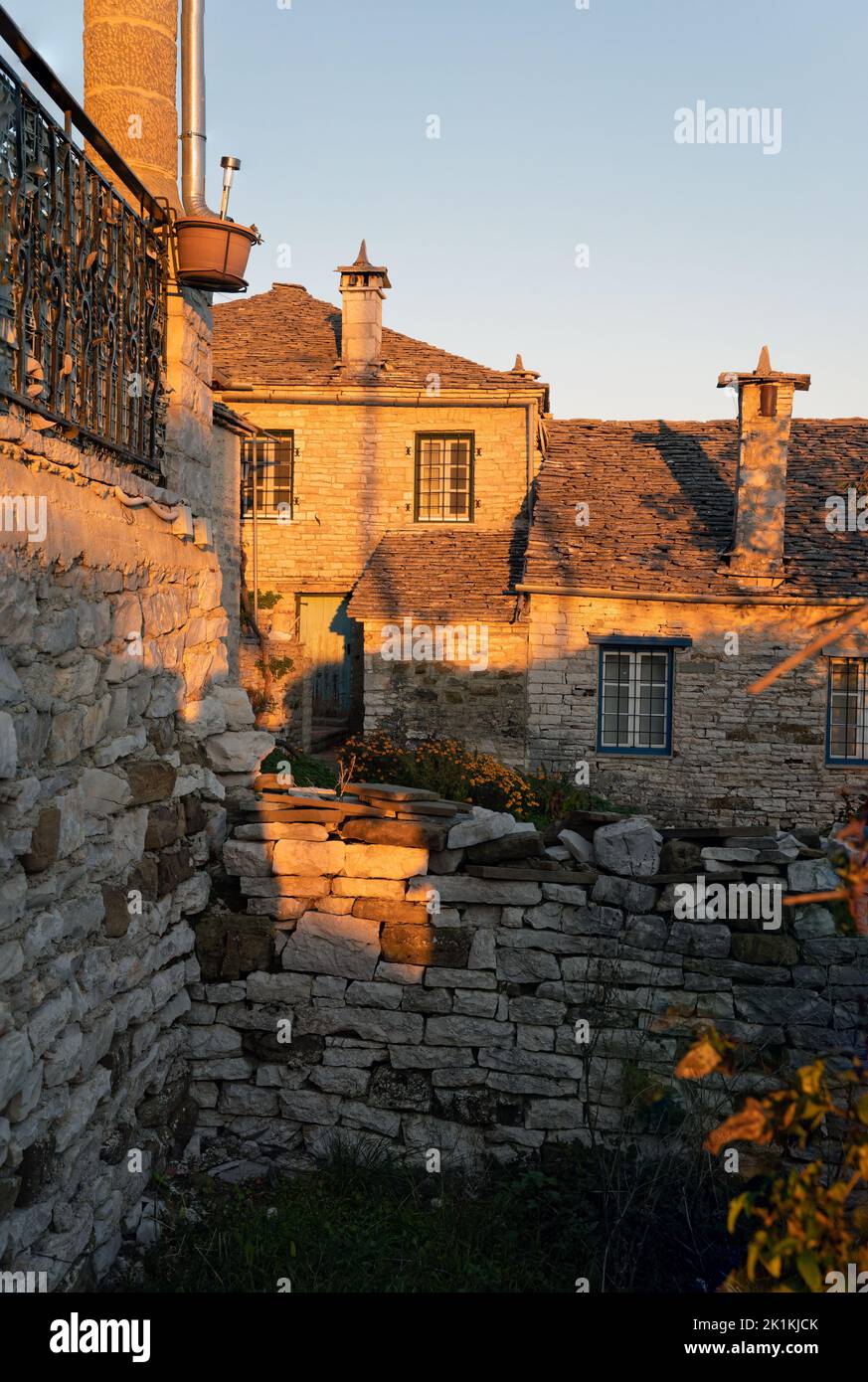Stone houses of traditional architecture in Vitsa, Greece at sunset ...