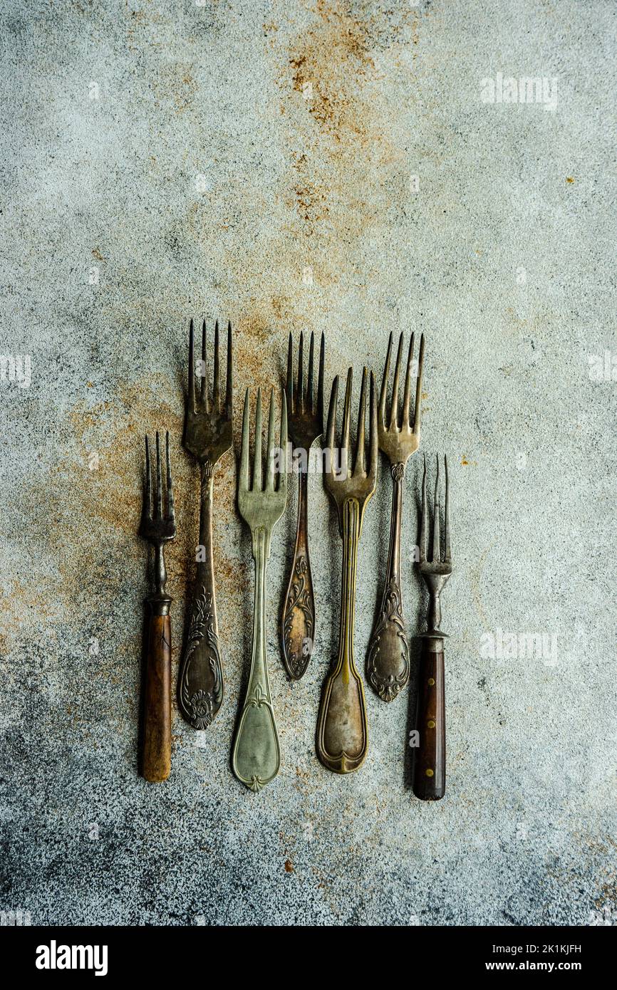 Overhead view of assorted vintage forks on a table Stock Photo - Alamy