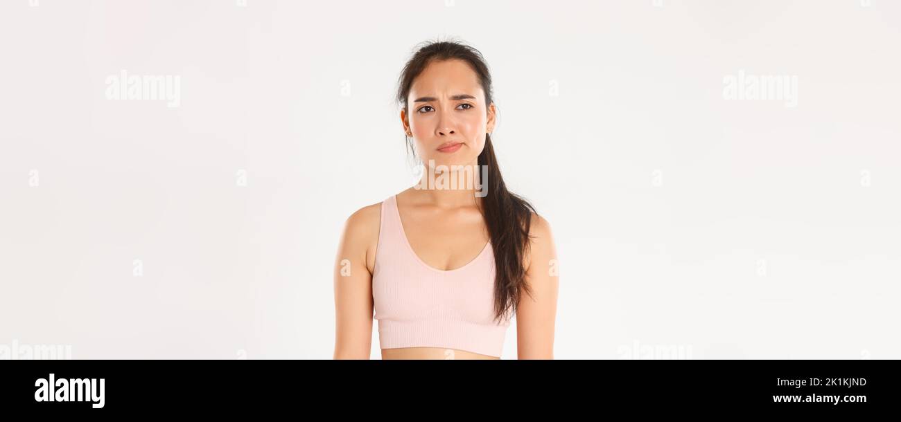 Sport, wellbeing and active lifestyle concept. Skeptical and displeased ...