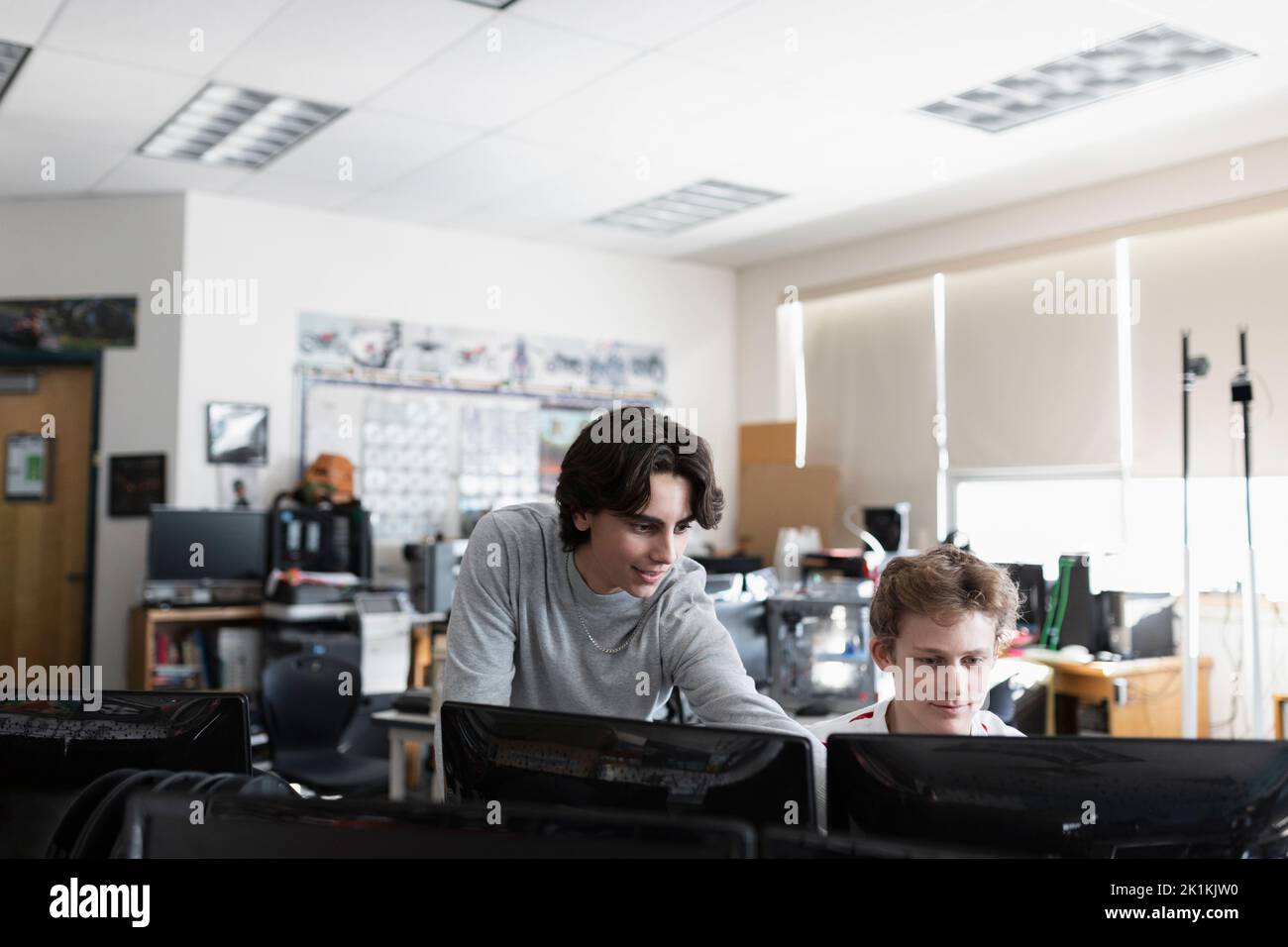 Students standing in front of school hi-res stock photography and ...