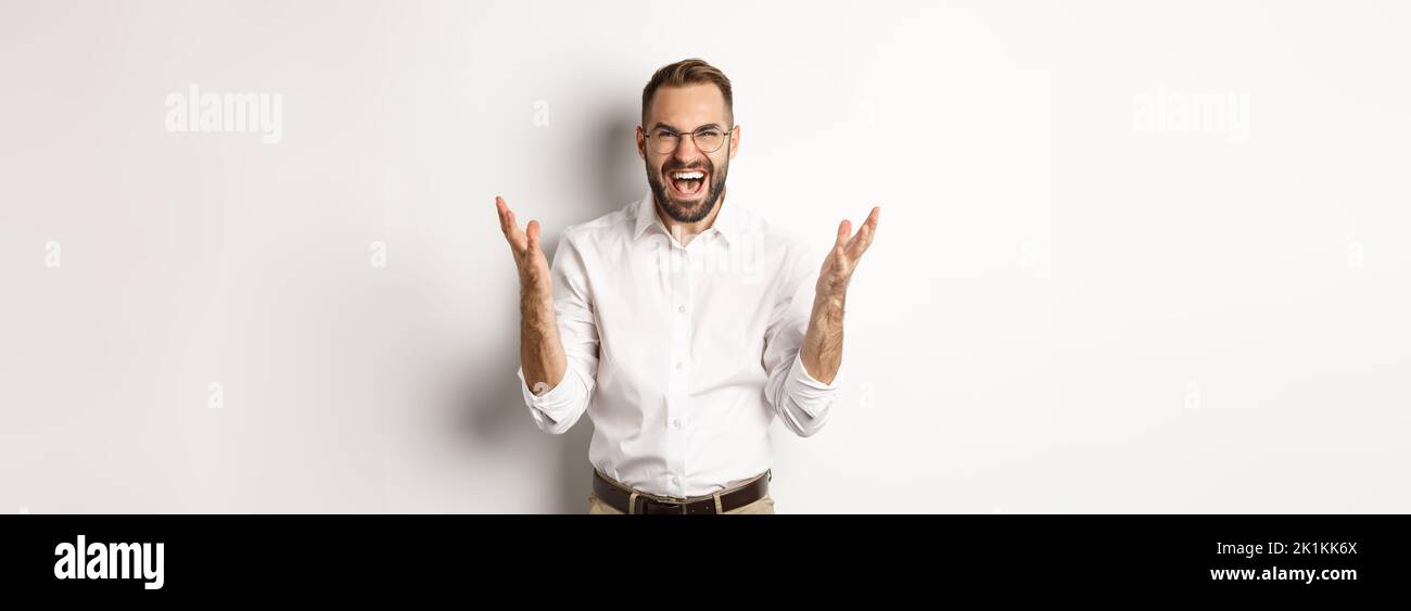 Frustrated and angry man screaming in rage, shaking hands furious ...