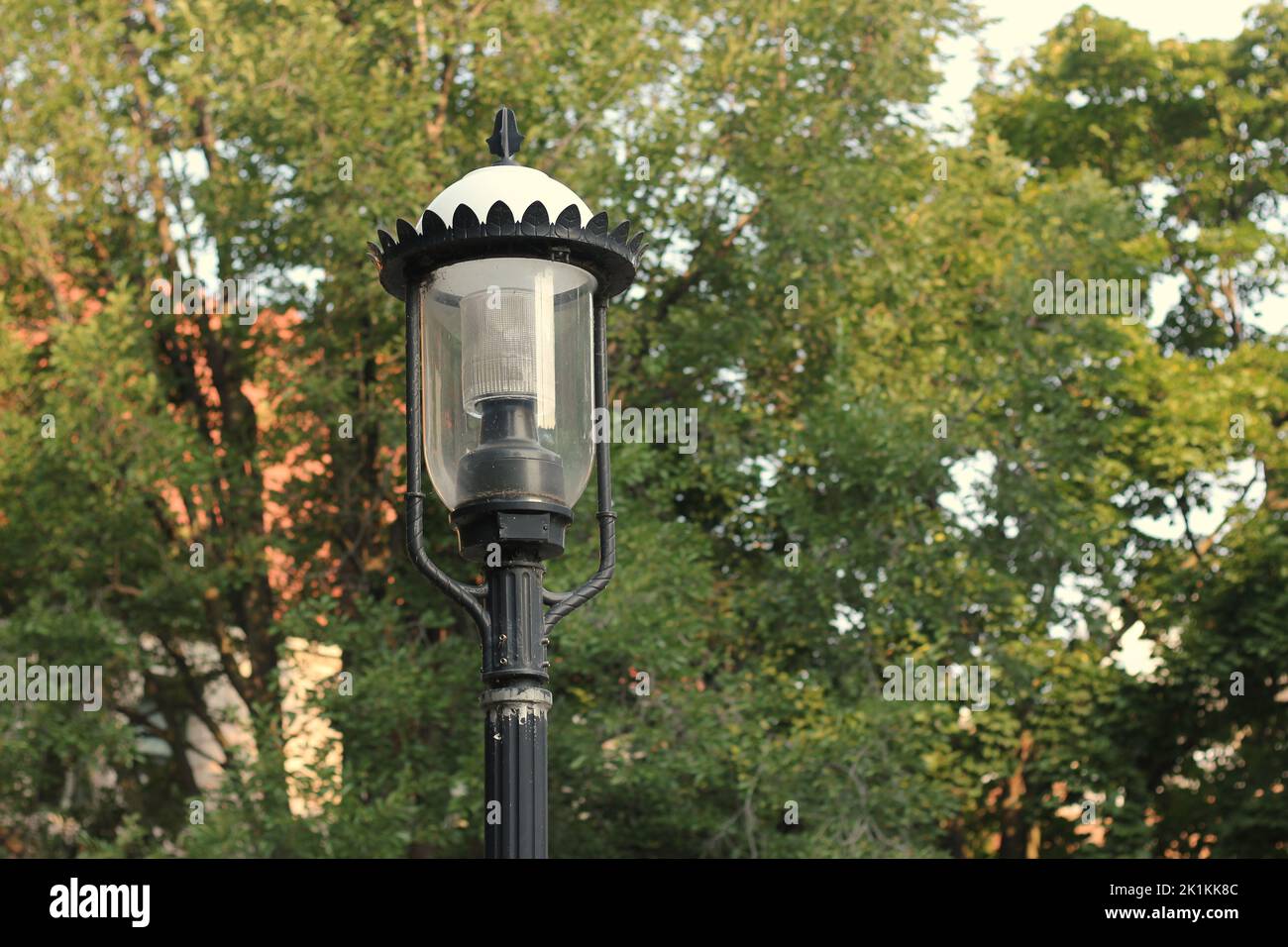 Ornate wrought iron metal street lamp Stock Photo - Alamy