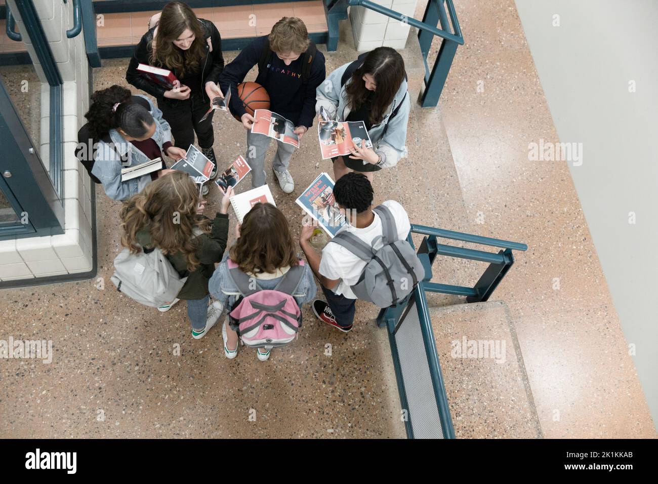 Group girls reading brochure hi-res stock photography and images - Alamy