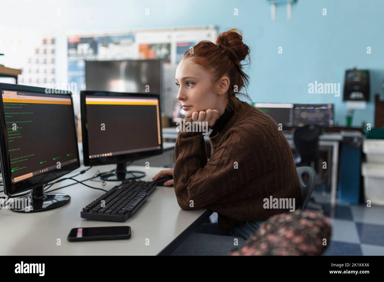 Focused high school girl using computers in classroom Stock Photo - Alamy