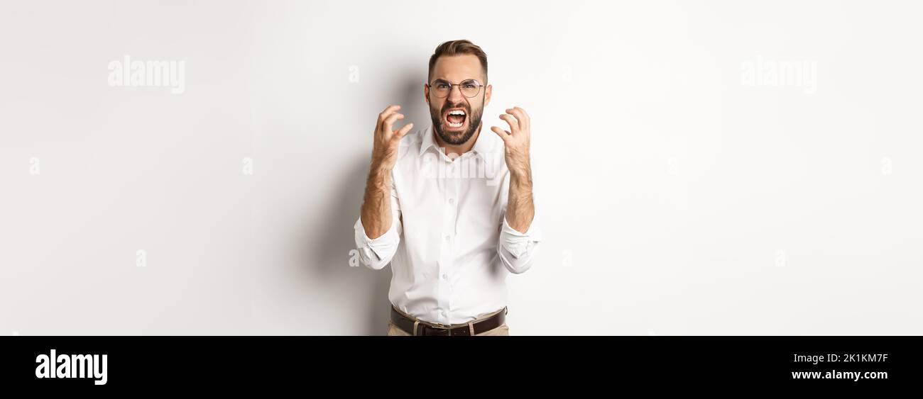 Frustrated and angry man screaming in rage, shaking hands furious ...