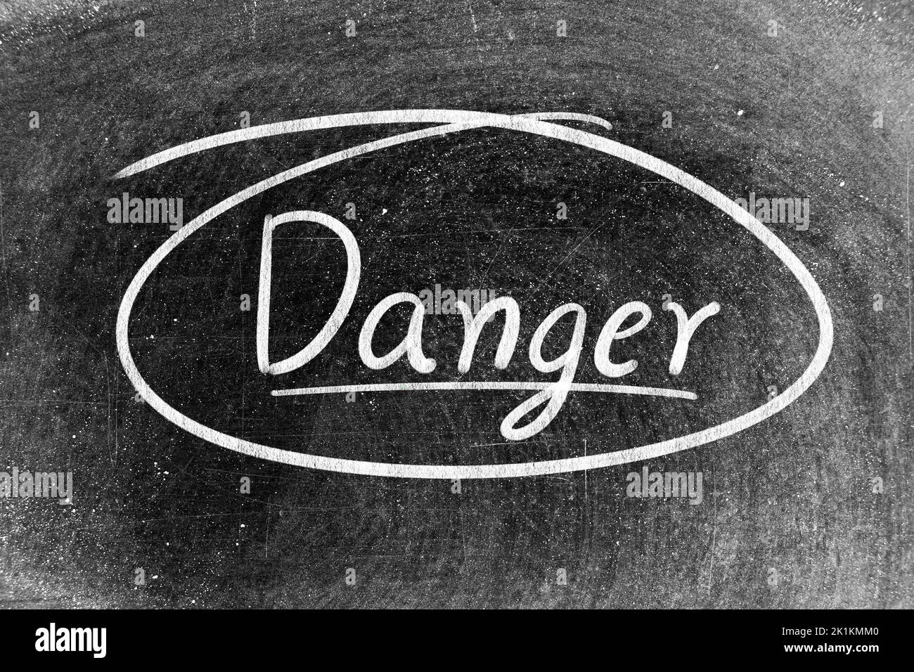 White chalk hand writing in word danger on blackboard background Stock ...