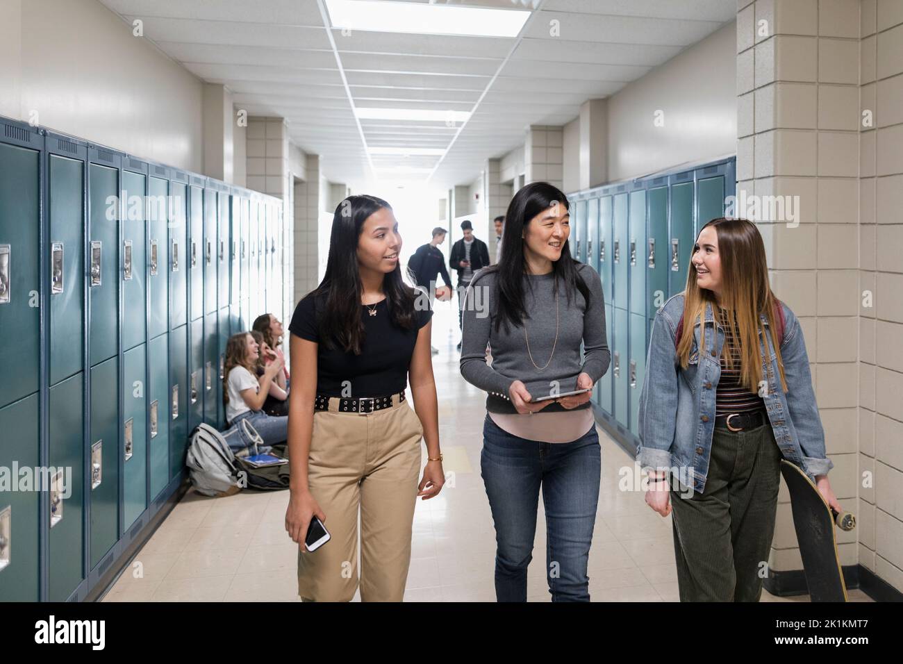 Teen girls talking hallway hi-res stock photography and images - Alamy