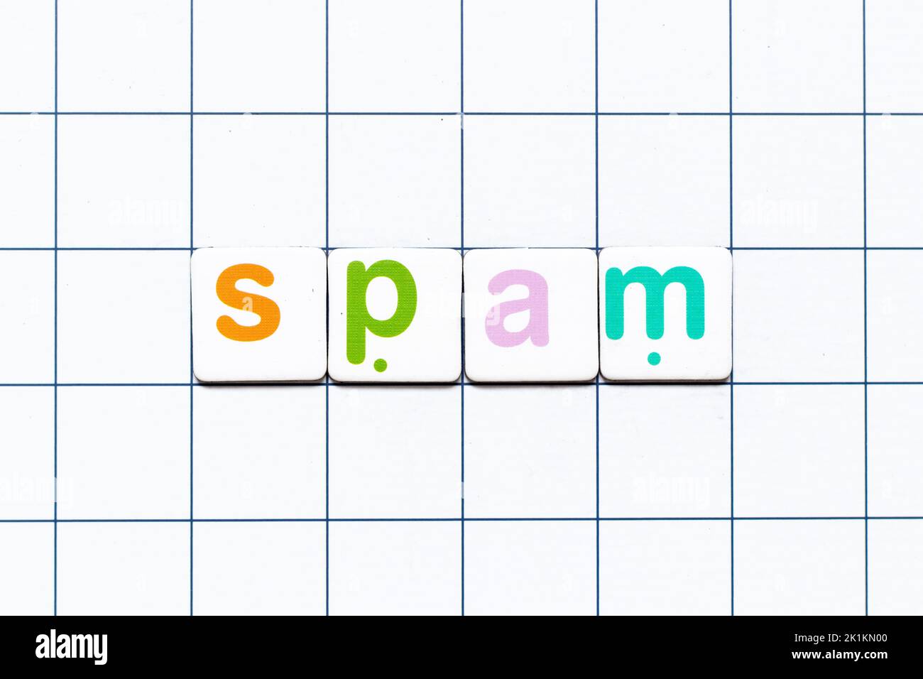 Colorful tile letter in word spam on white grid background Stock Photo ...