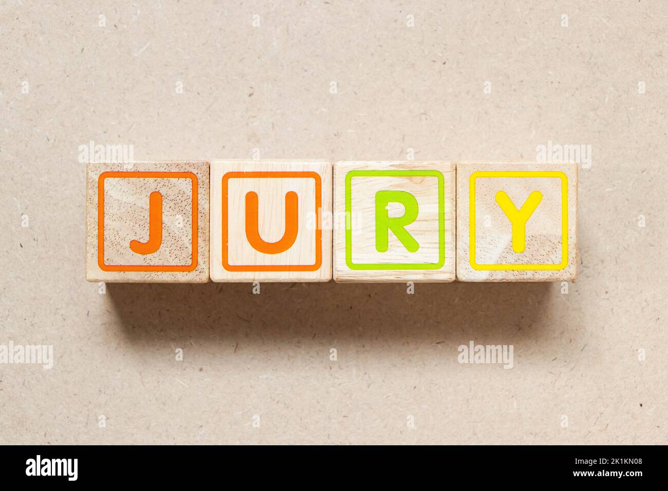Color letter block in word jury on wood background Stock Photo - Alamy