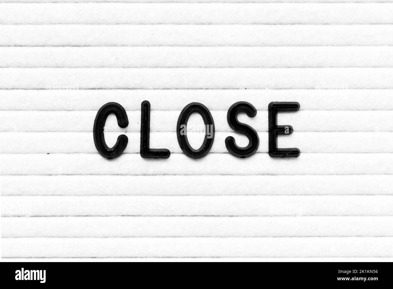 Black color letter in word close on white felt board background Stock ...