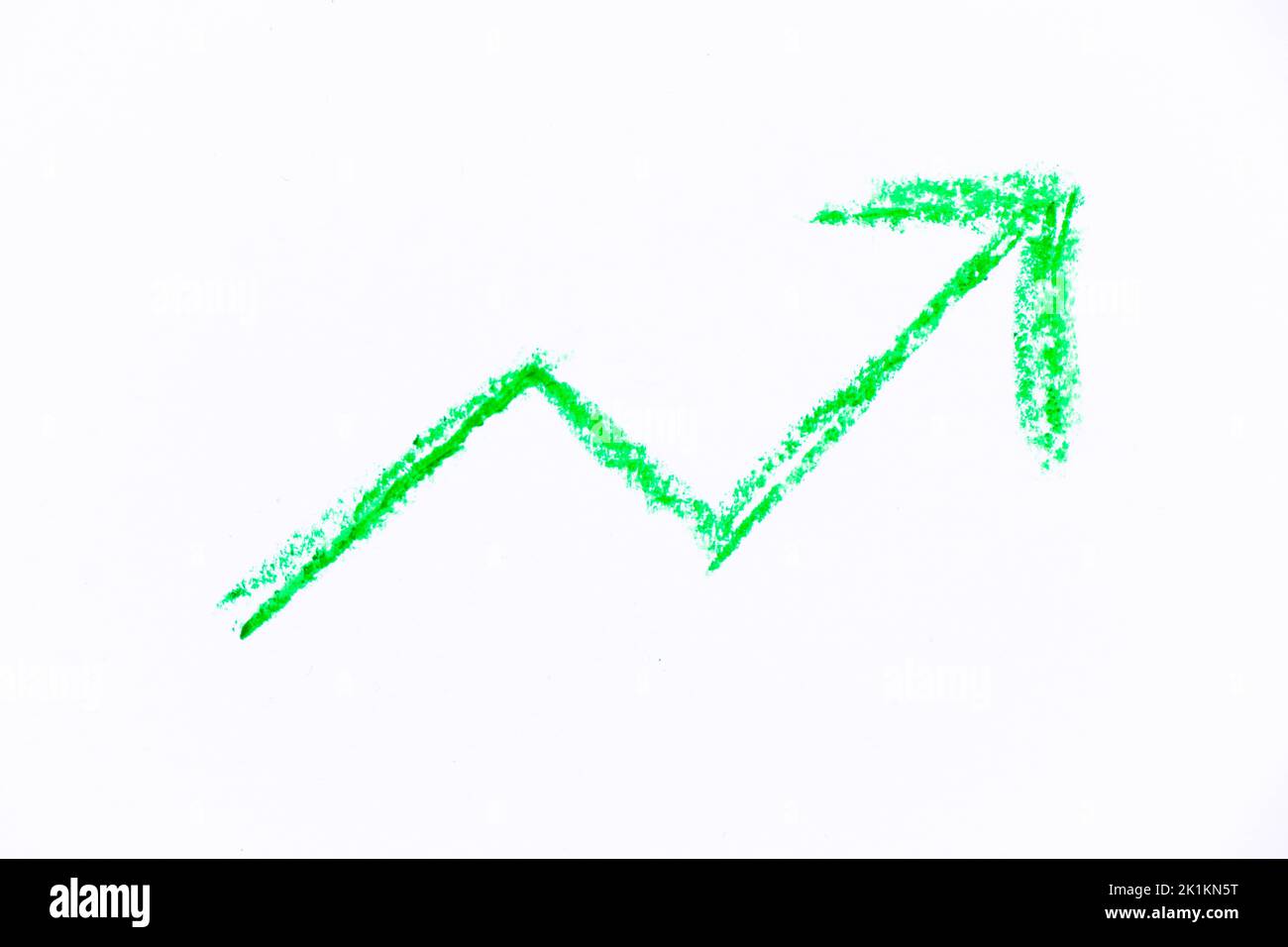 Green color oil pastel hand drawing in upward trend arrow shape on white paper background Stock ...