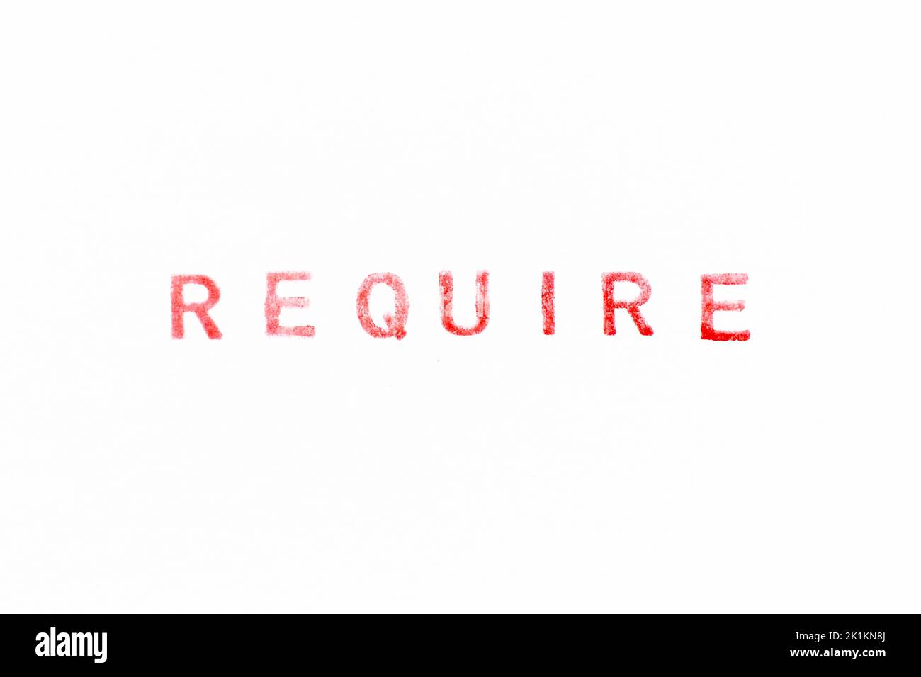 Red color ink rubber stamp in word require on white paper background ...