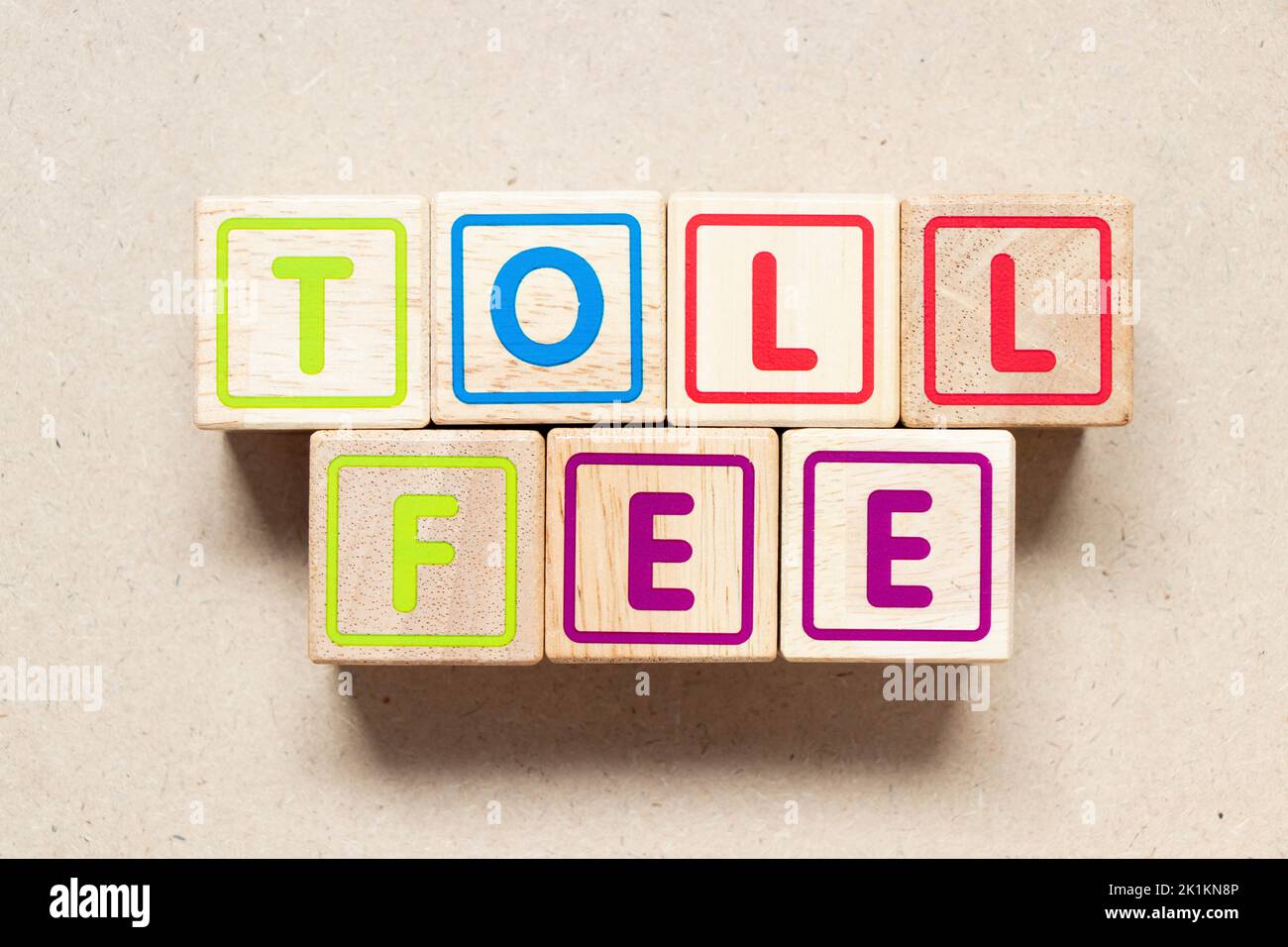 Color letter block in word toll fee on wood background Stock Photo - Alamy