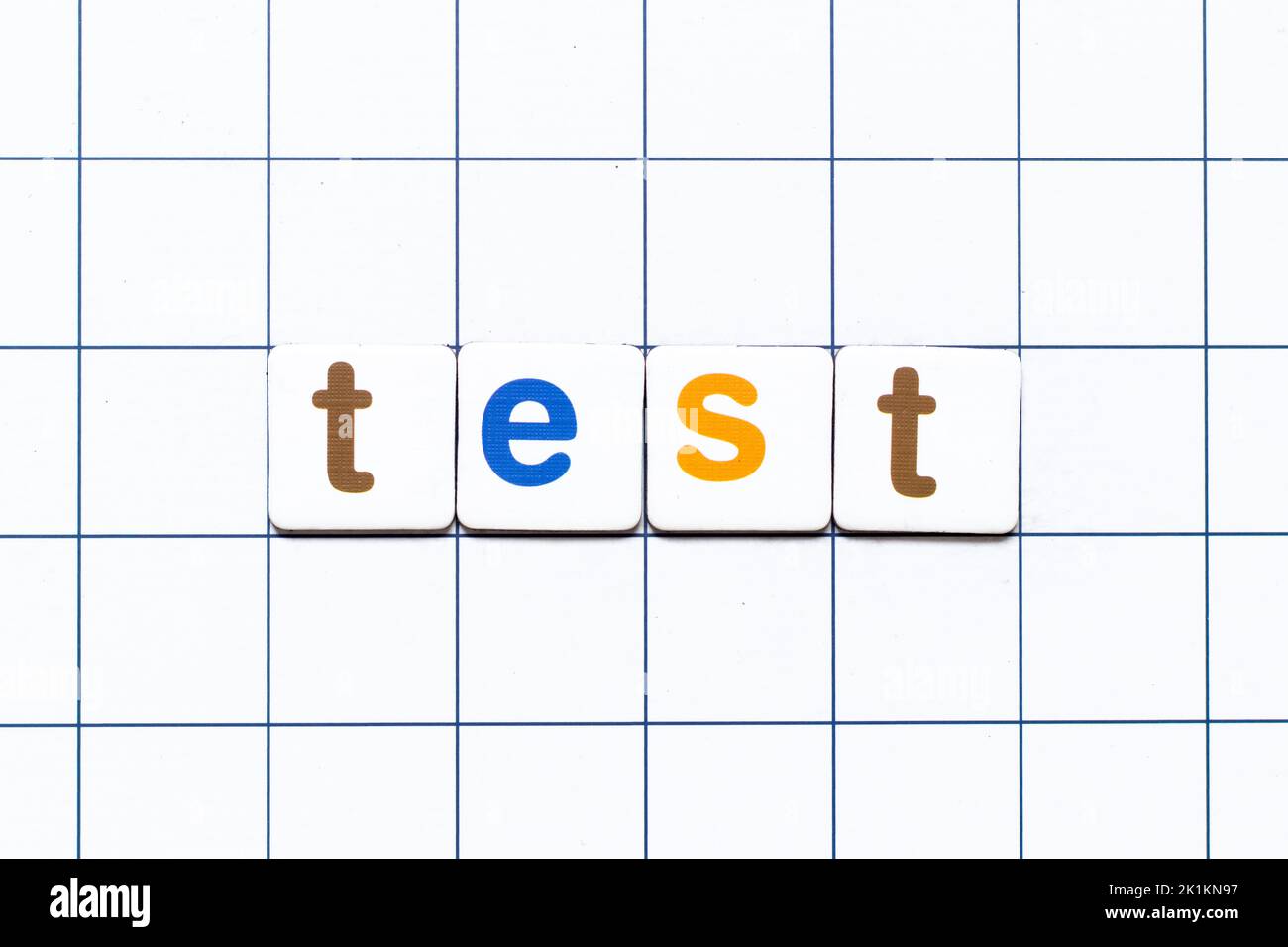 Colorful tile letter in word test on white grid background Stock Photo ...