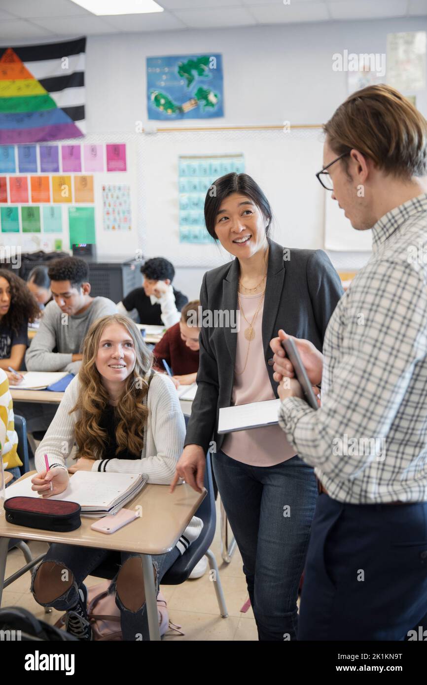 Three teachers talking hi-res stock photography and images - Alamy