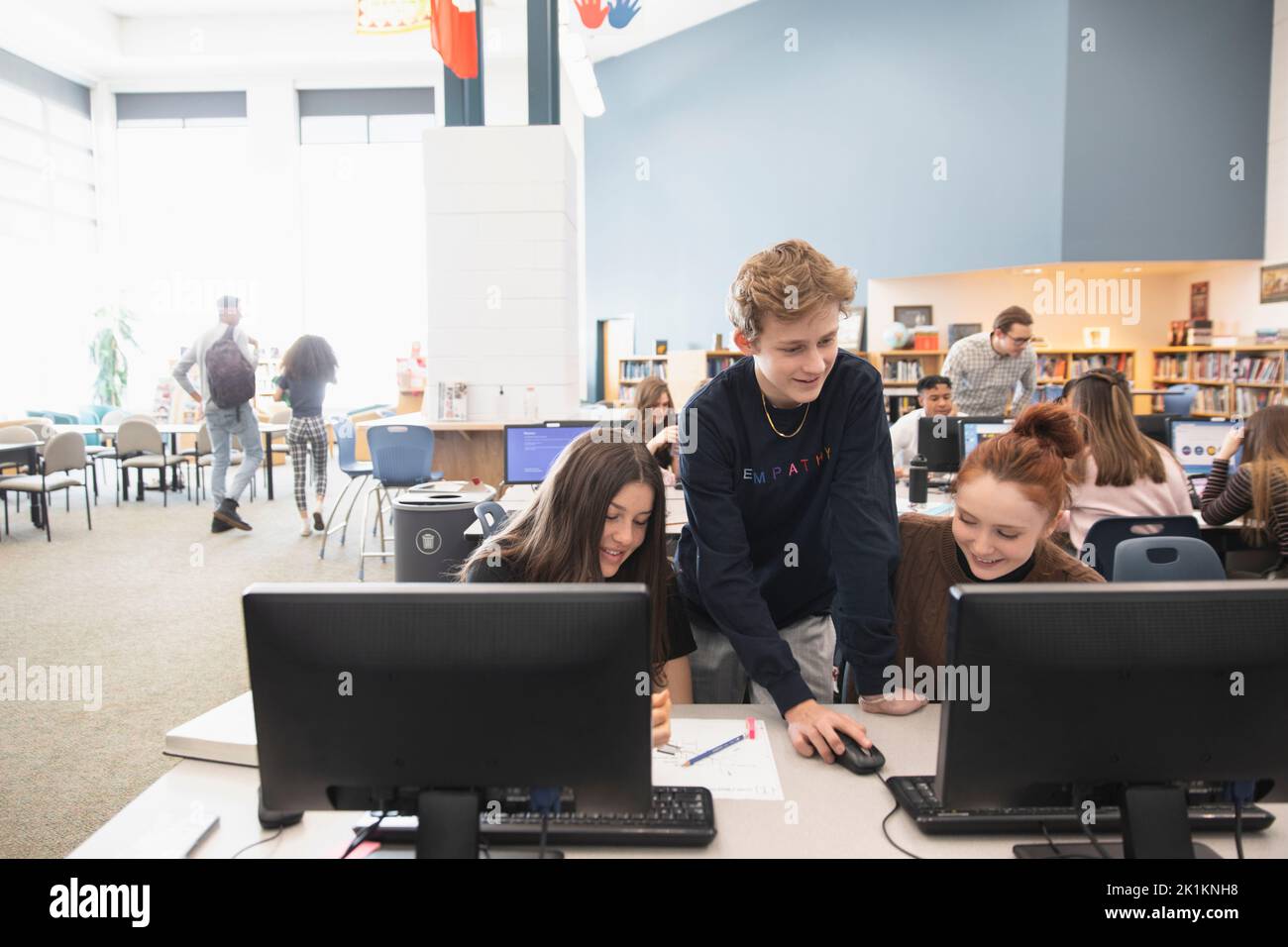 High school students studying at computers in library Stock Photo - Alamy