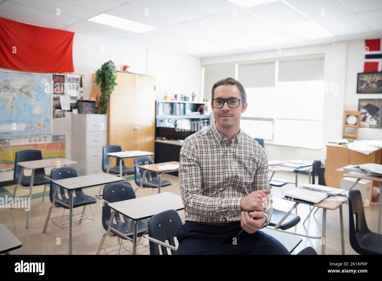 Male teacher sitting desk in hi-res stock photography and images - Alamy