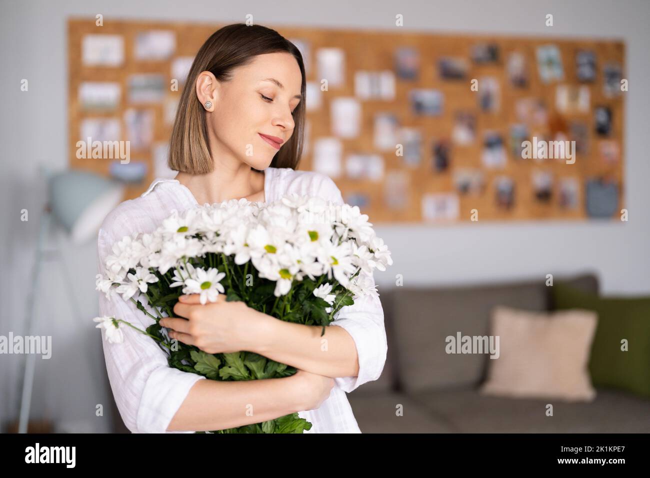 Young beautiful cute sweet lovely smiling woman with hold a bouquet of ...