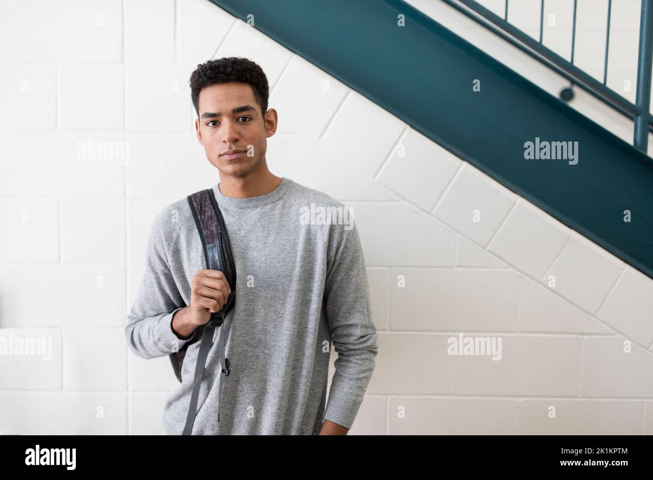 High school boy standing in hi-res stock photography and images - Alamy