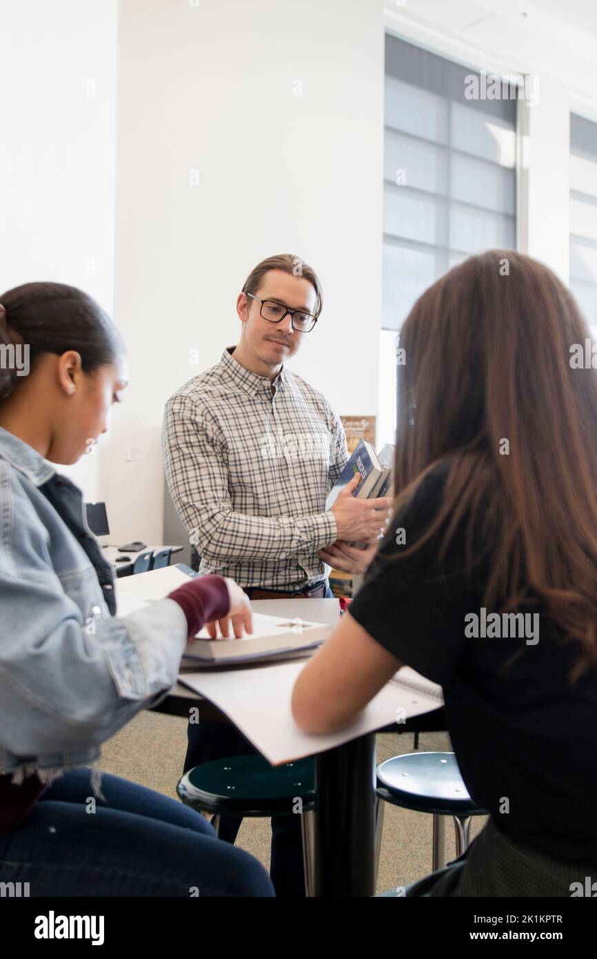 Student librarian talking hi-res stock photography and images - Alamy