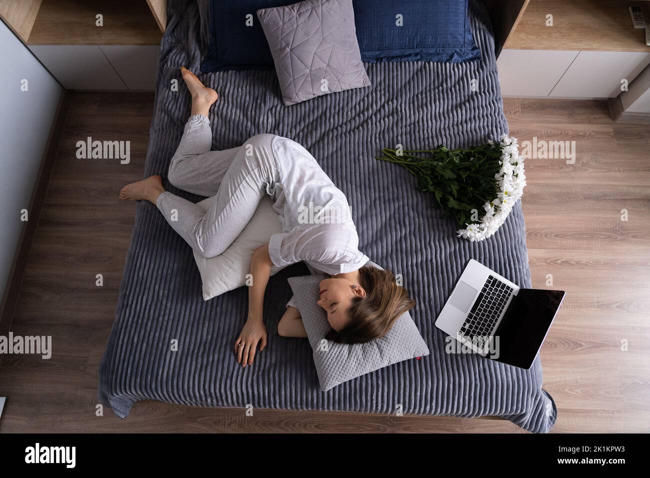 Caucasian Woman wearing white casual clothes got asleep while using ...