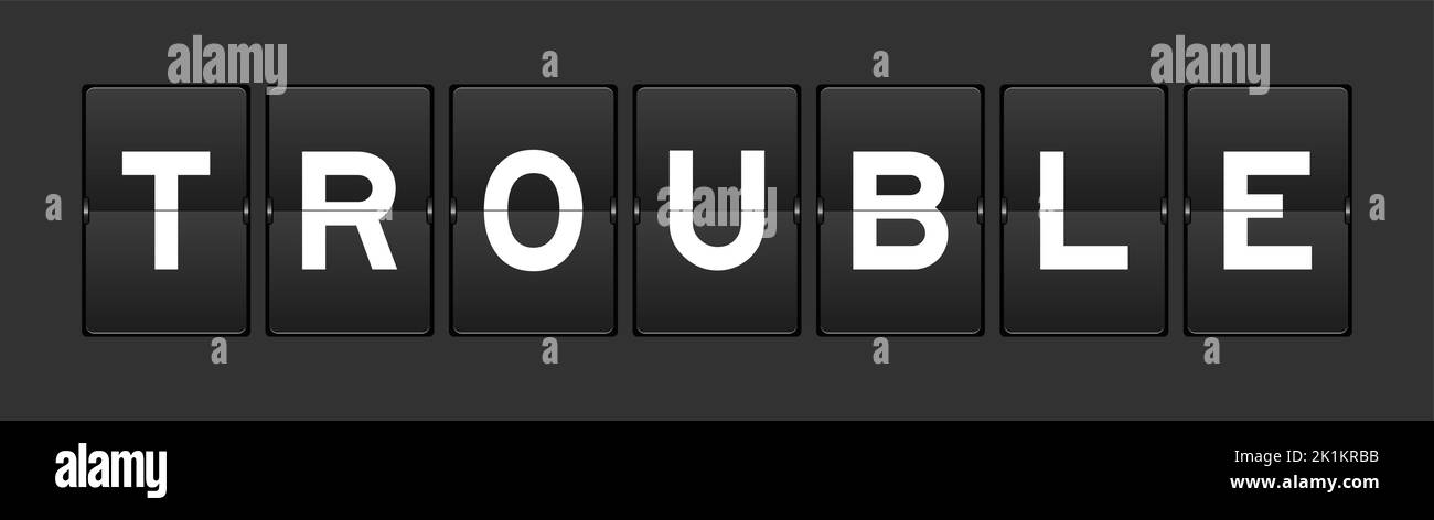 Black color analog flip board with word trouble on gray background ...