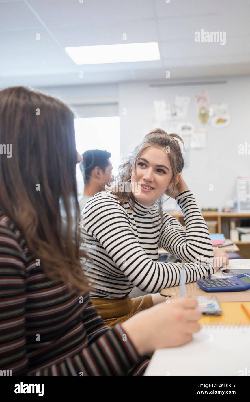 Two students talking at desk hi-res stock photography and images - Alamy