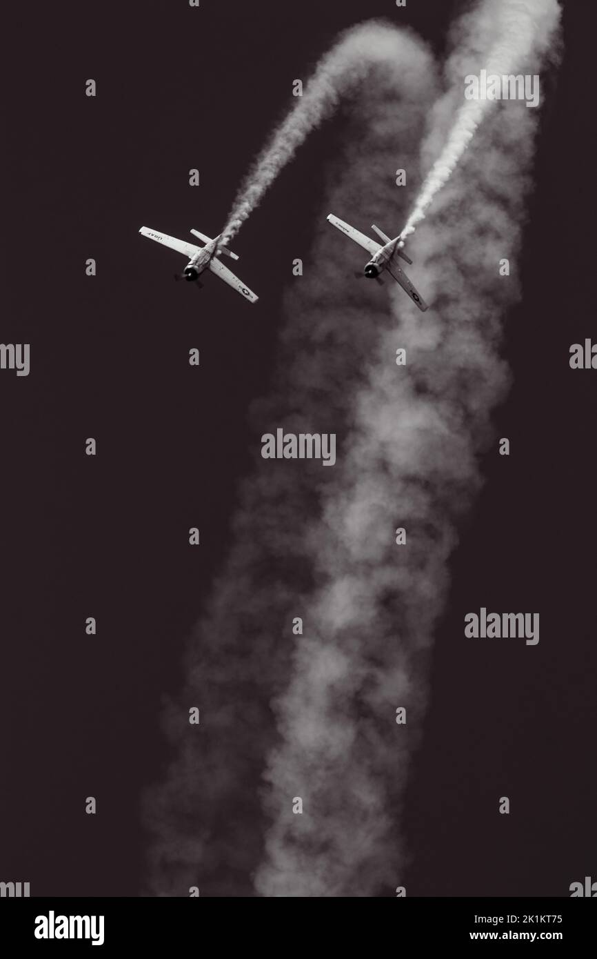 A vertical of two airplanes making a circle Stock Photo - Alamy