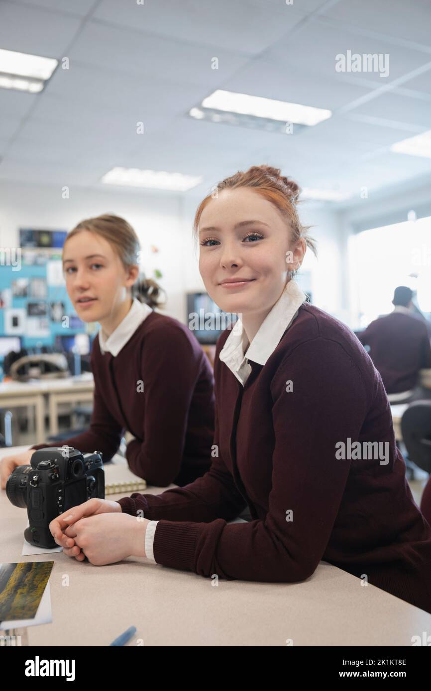 Portrait confident high school girl students in photography class Stock ...