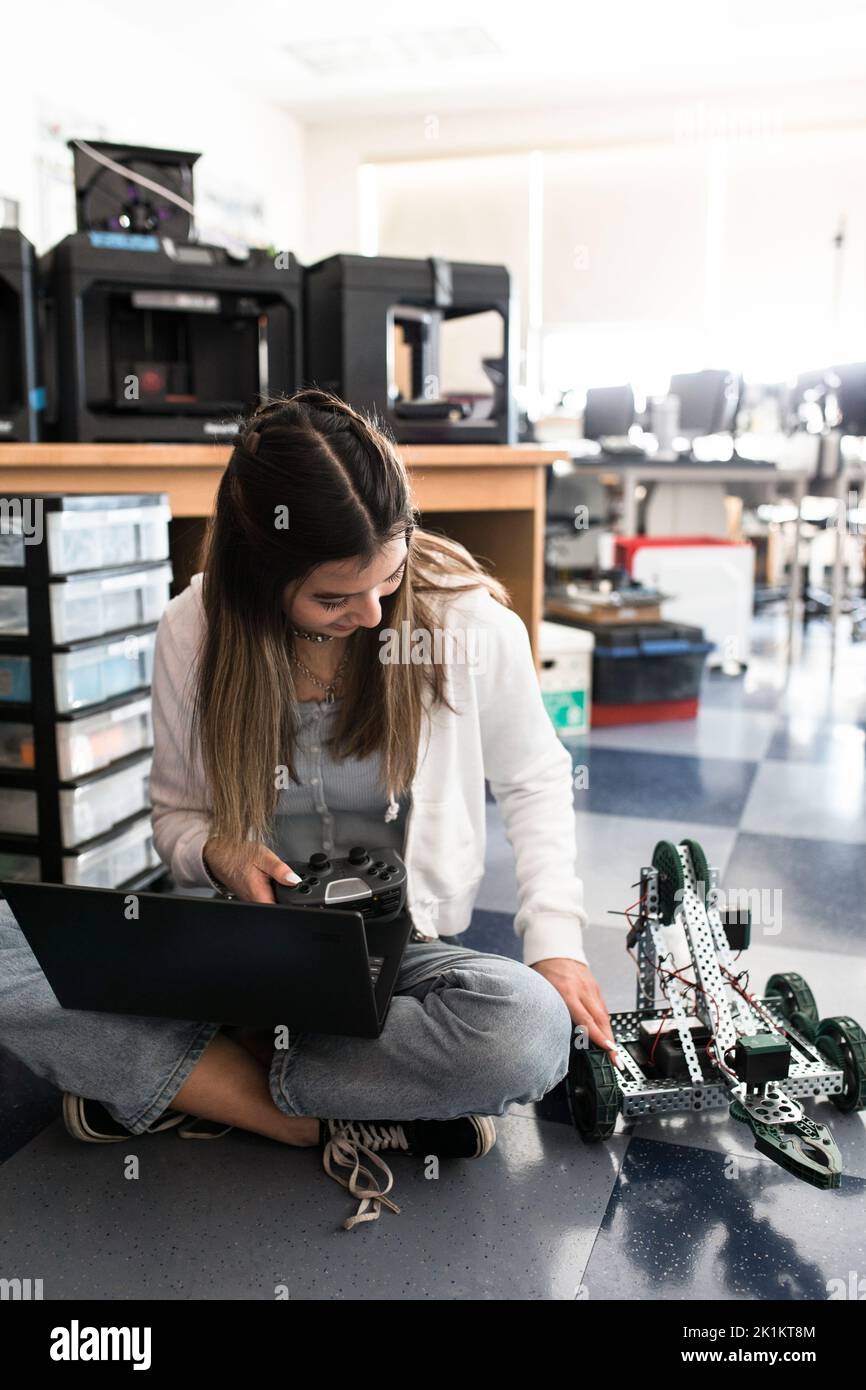 School girl sitting on floor hi-res stock photography and images - Alamy