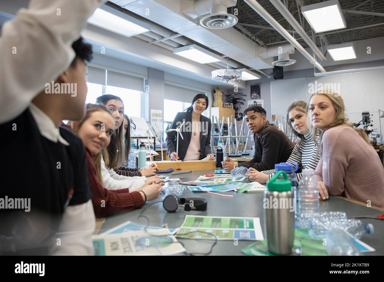 High school teacher and students working on environmental project Stock ...