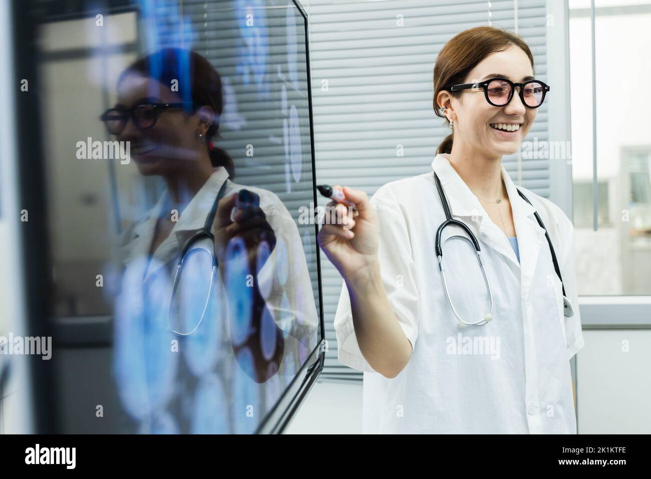 female doctor check on scan results and looking at monitors in ...